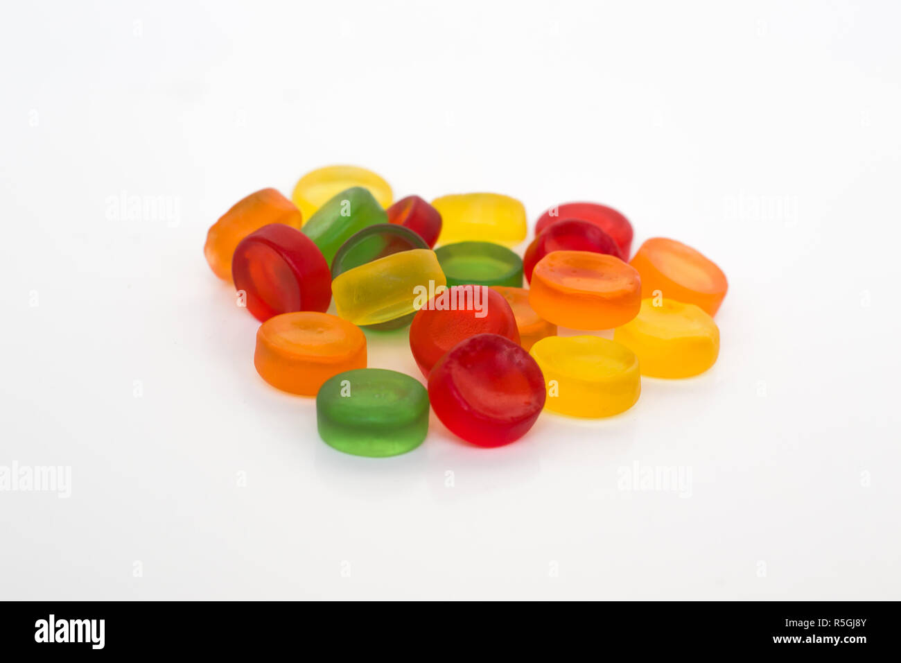 Round gummy candy isolated on white background Stock Photo - Alamy
