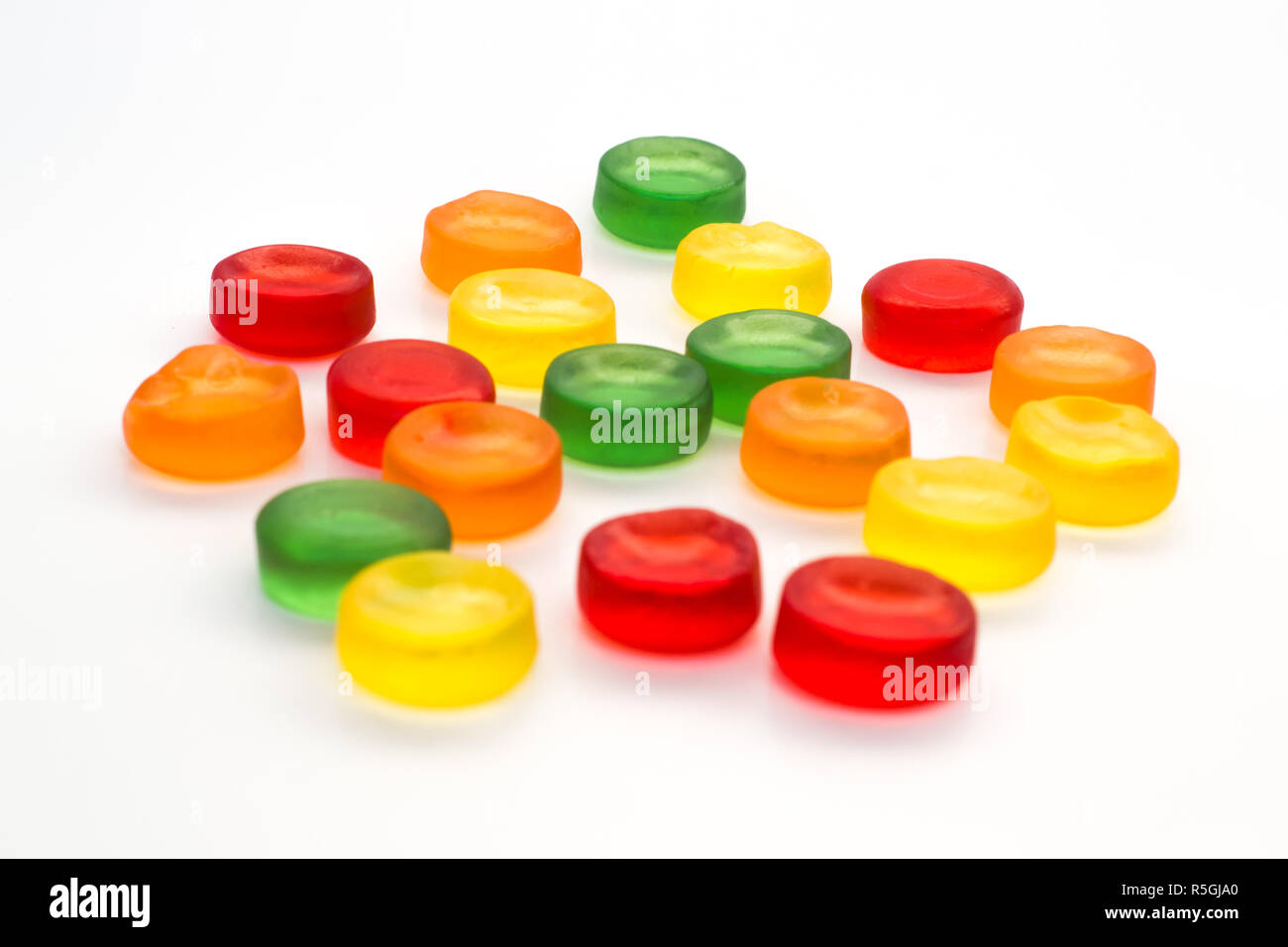 Round gummy candy isolated on white background Stock Photo - Alamy