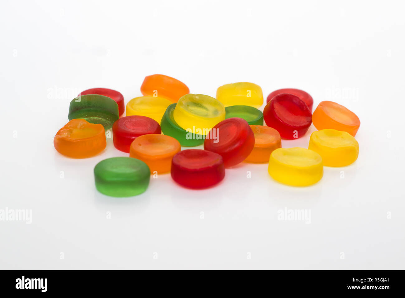 Round gummy candy isolated on white background Stock Photo - Alamy