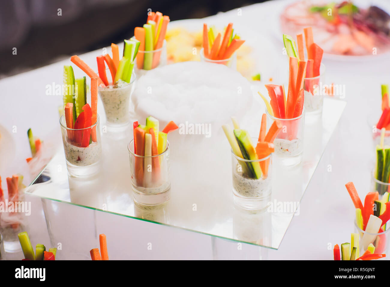 Salad plate and dry ice. Pieces in salad Stock Photo - Alamy