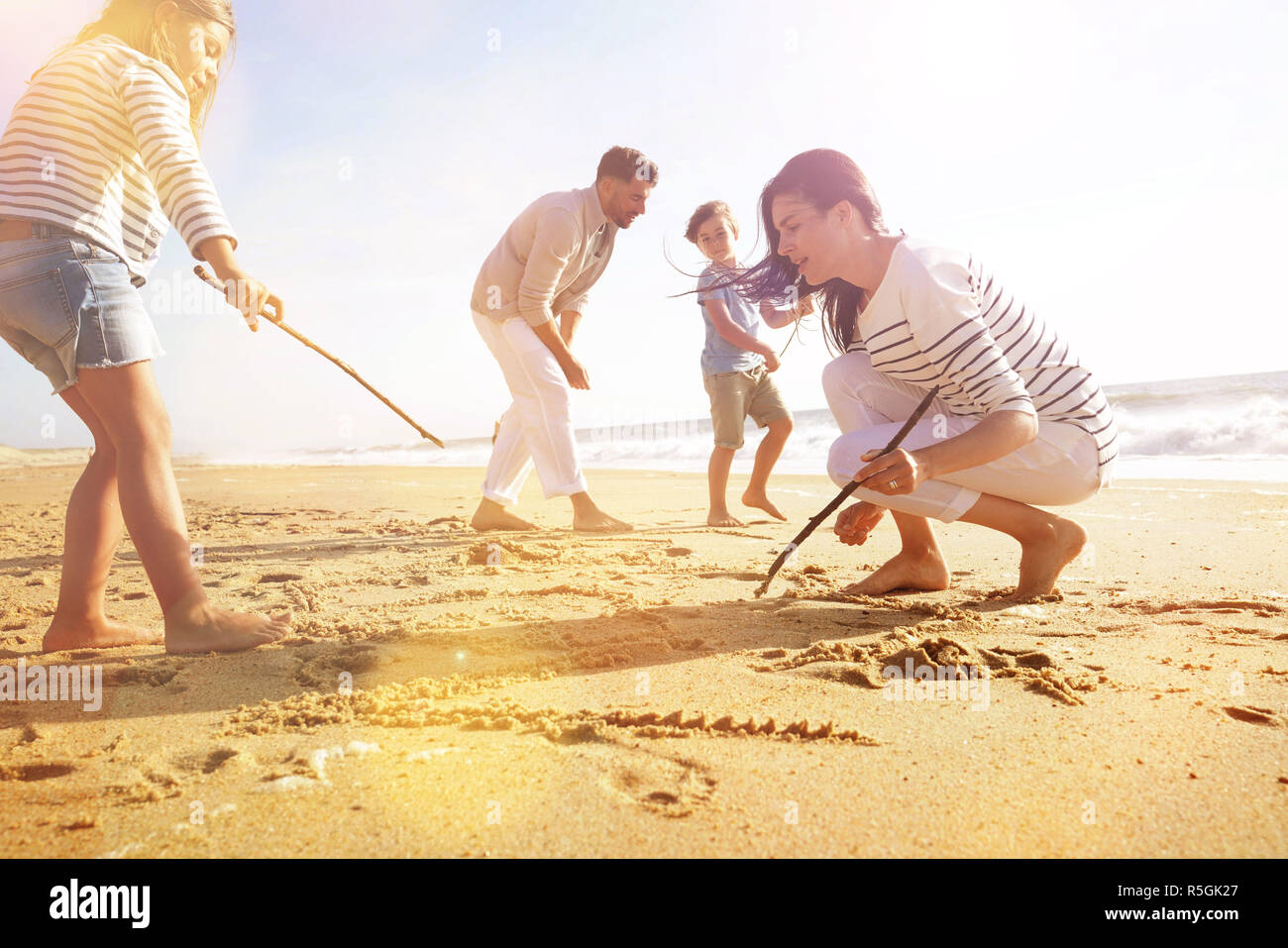 Family Writing Sand High Resolution Stock Photography and Images - Alamy