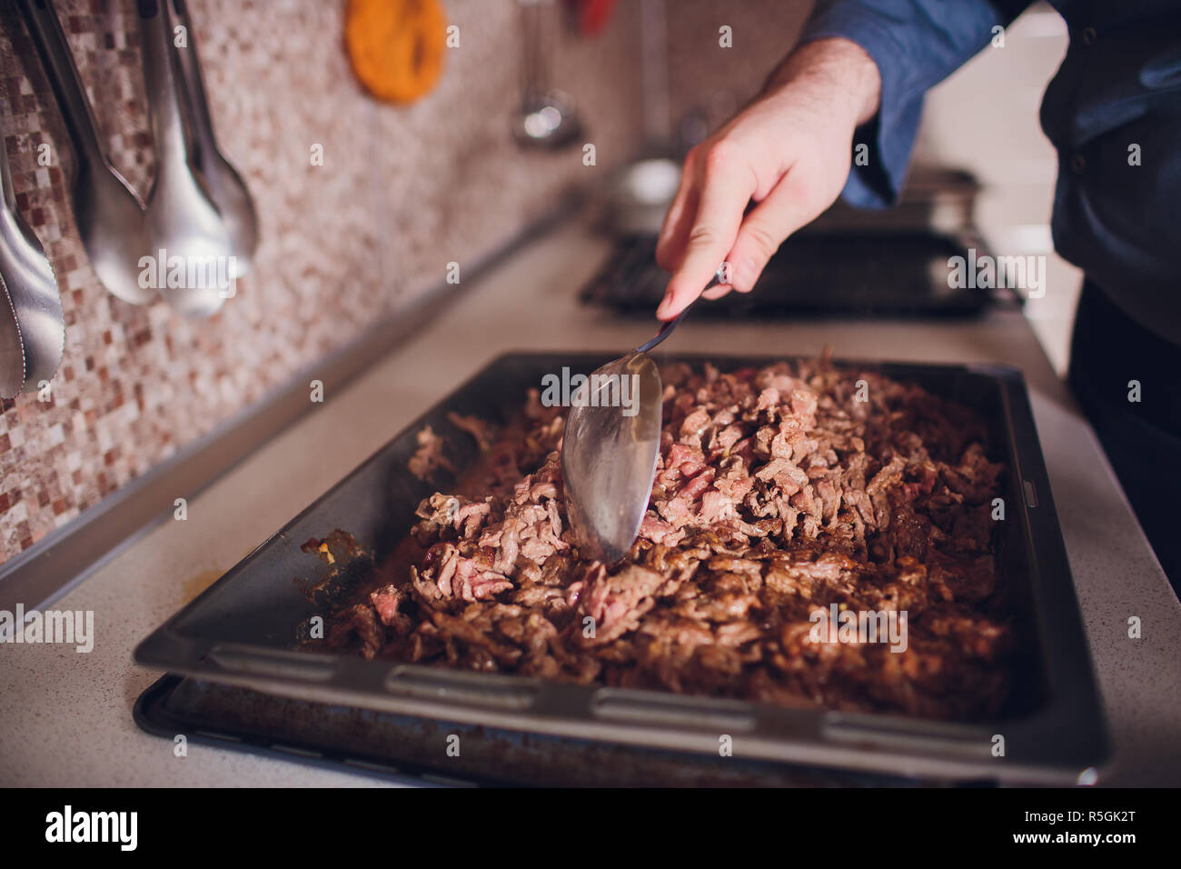 Chef cuts bloody steak cooking hi-res stock photography and images - Alamy