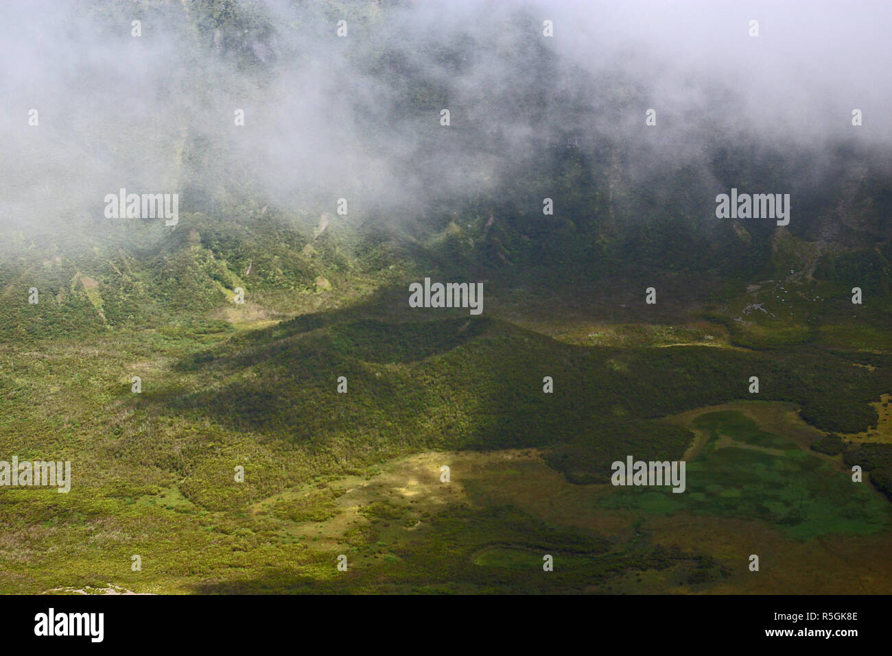 Caldera of the of the island of Faial (Azores) partly wrapped in ...