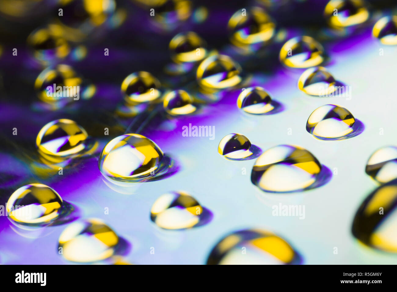 yellow water drops Stock Photo - Alamy