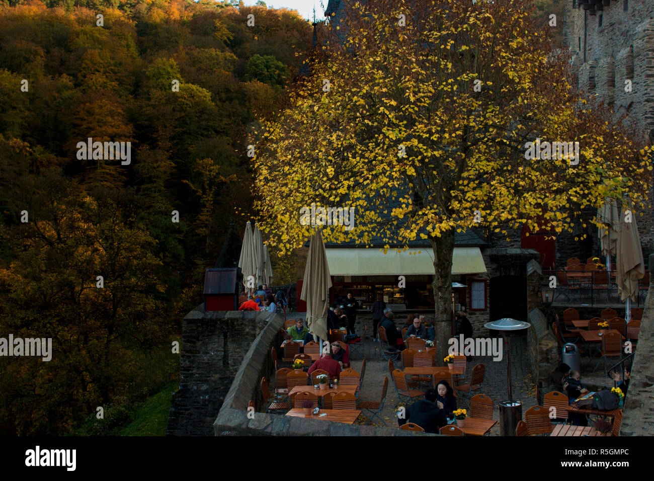 Outdoor terrace at the Eltz Castle Germany with autumn forest in the ...