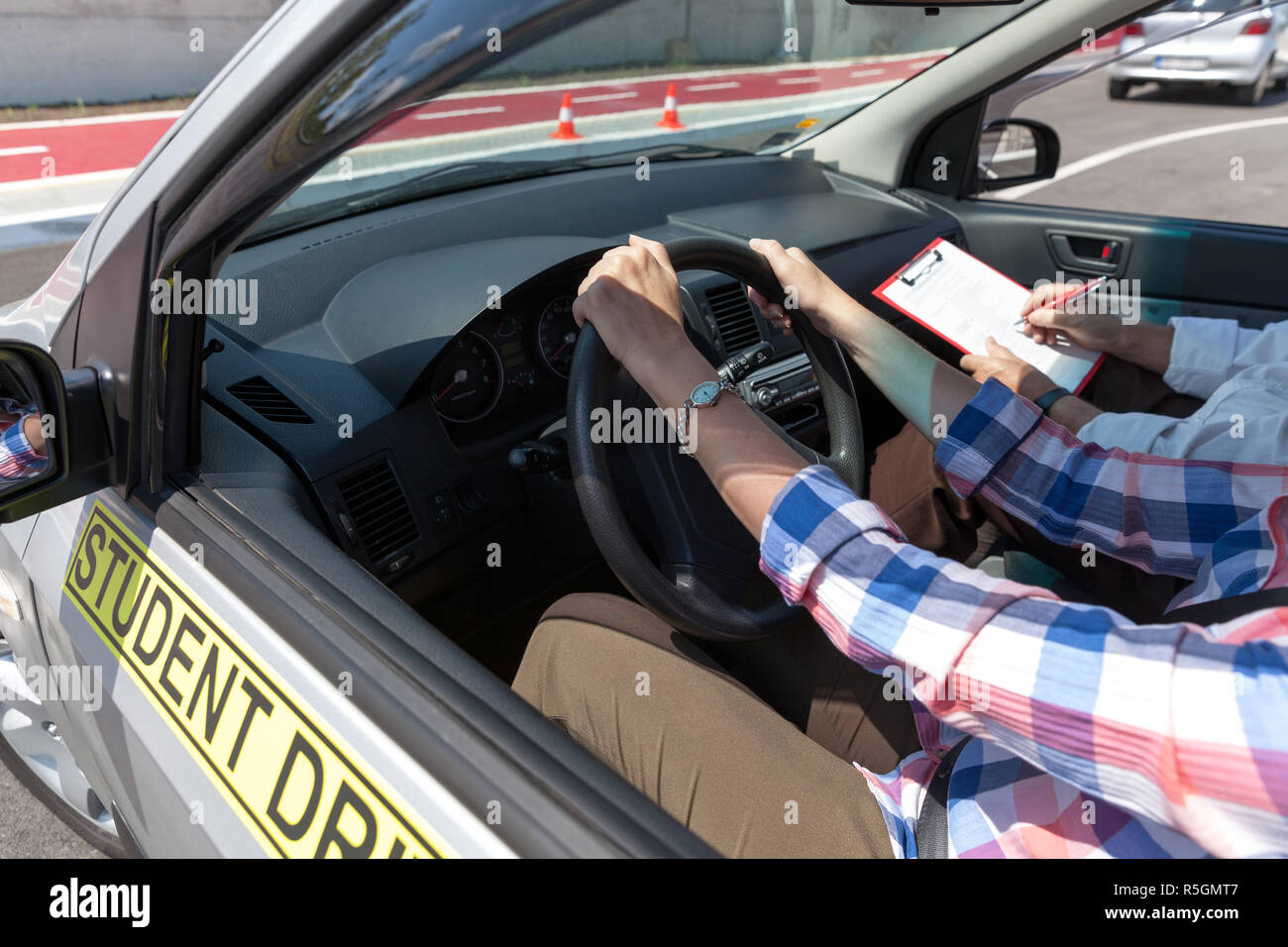 Learner driver student driving car with instructor Stock Photo - Alamy