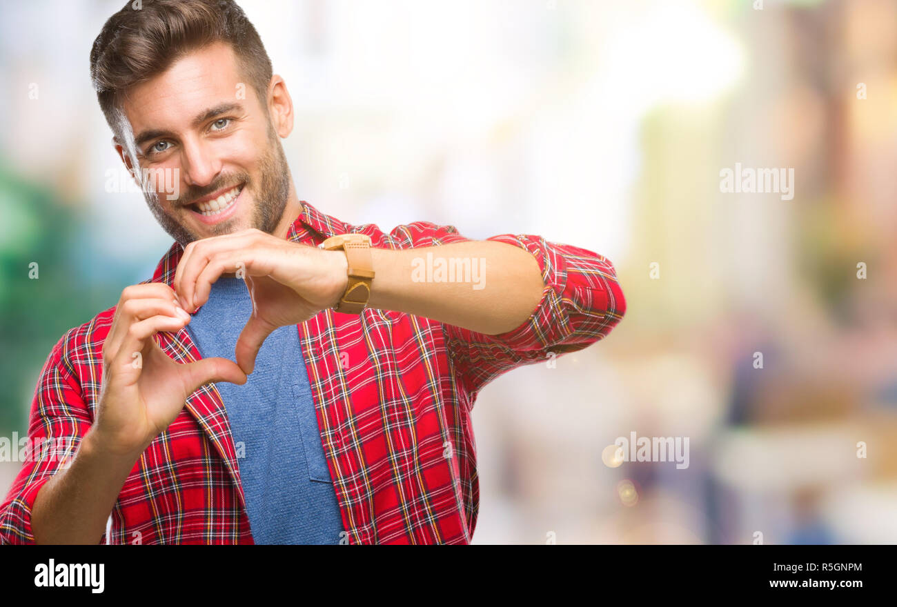 Young handsome man over isolated background smiling in love showing ...