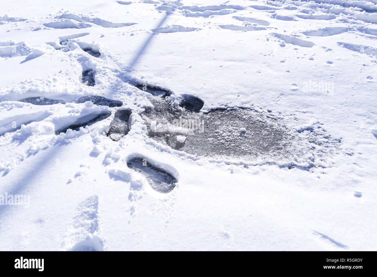 Footprint and hands on snow for texture background Stock Photo - Alamy