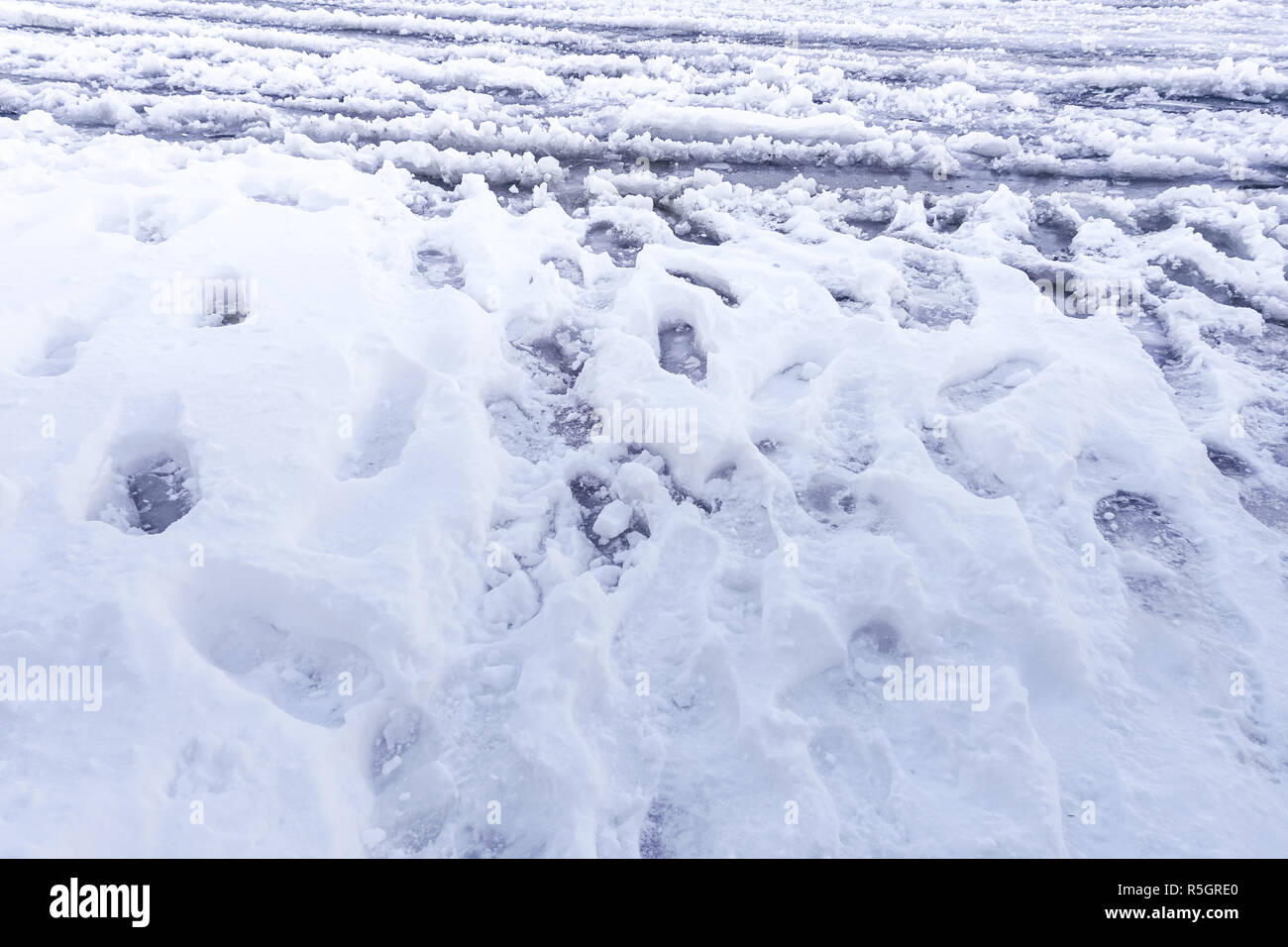 Footprint and hands on snow for texture background Stock Photo - Alamy