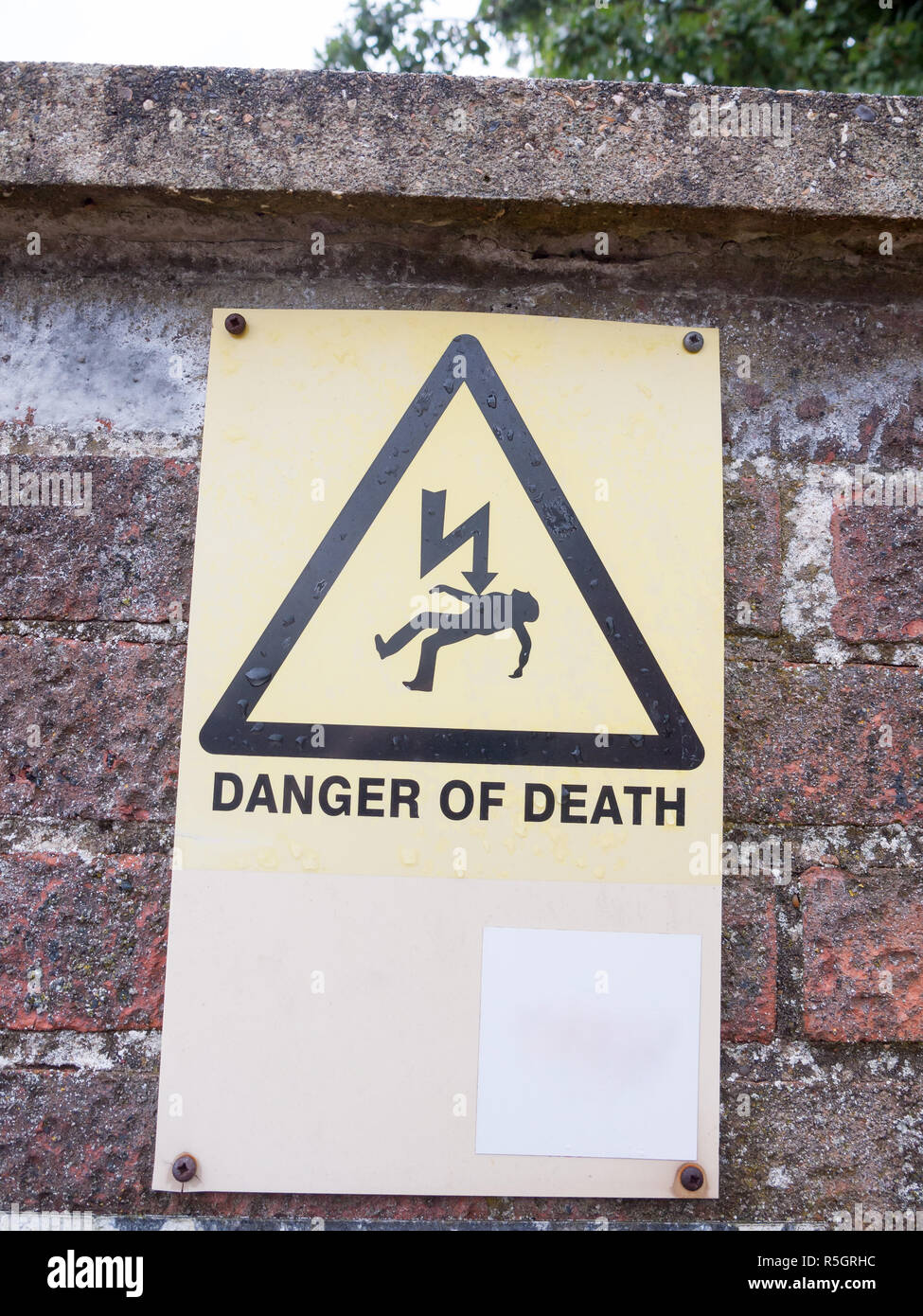 danger of death yellow sign with lightening Stock Photo - Alamy