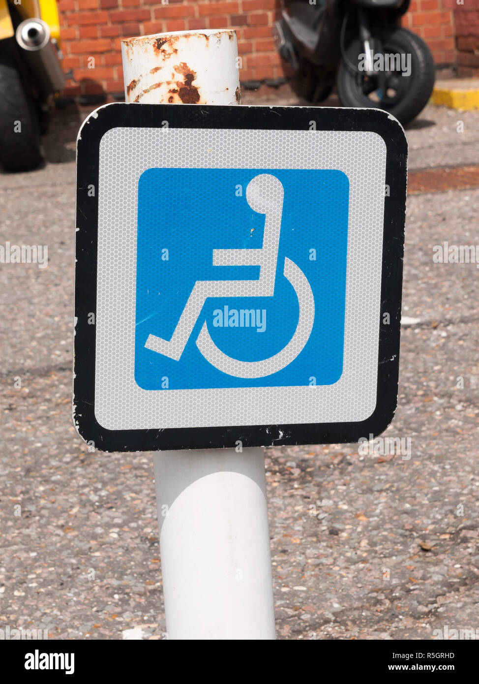 disabled parking sign on post a train station Stock Photo - Alamy