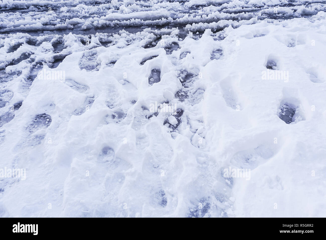 Footprint and hands on snow for texture background Stock Photo - Alamy