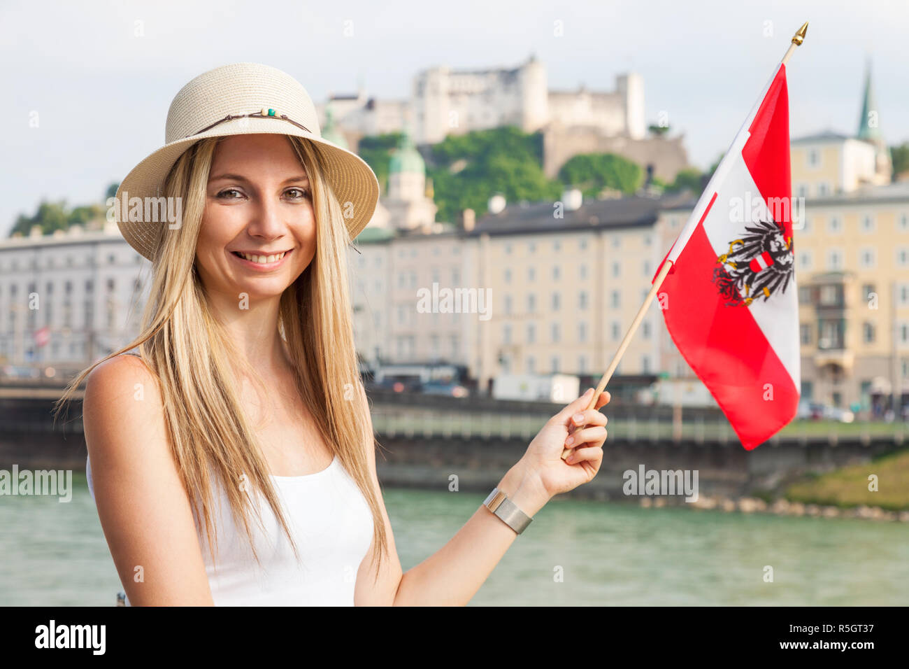 Female tourist on vacation in Salzburg Austria holding the Austrian ...
