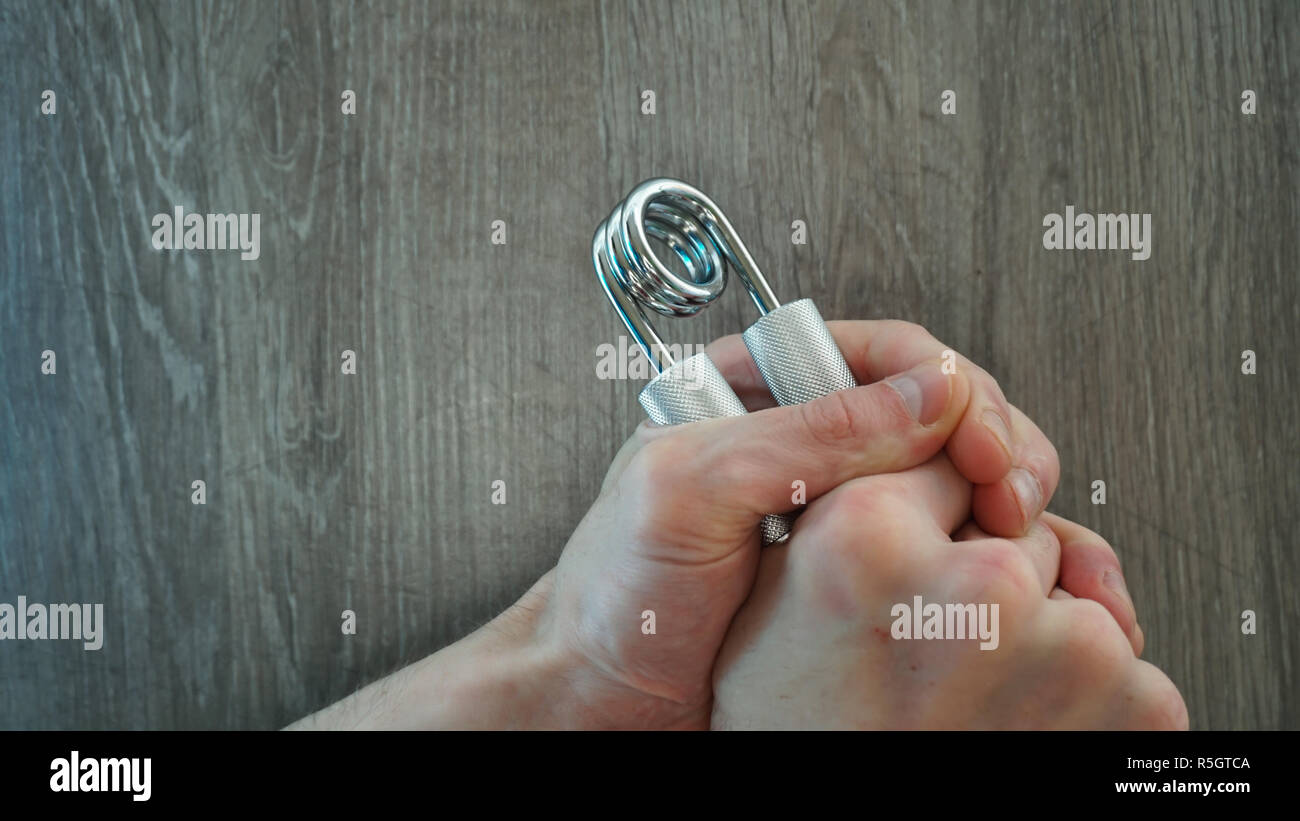 hand expander in the hand of a young athlete Stock Photo - Alamy