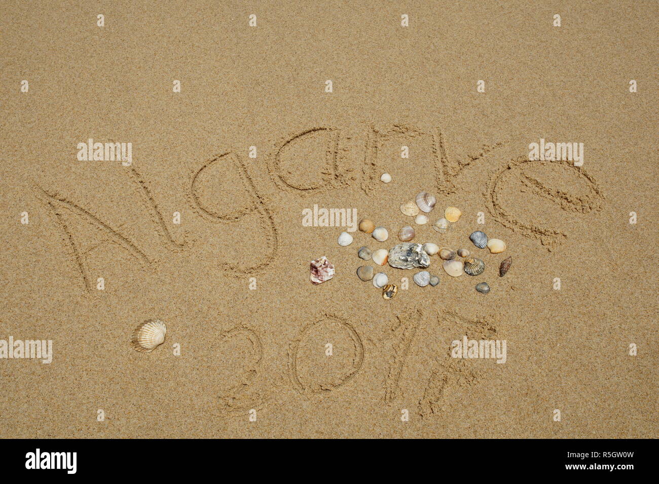 lettering in the sand Stock Photo - Alamy
