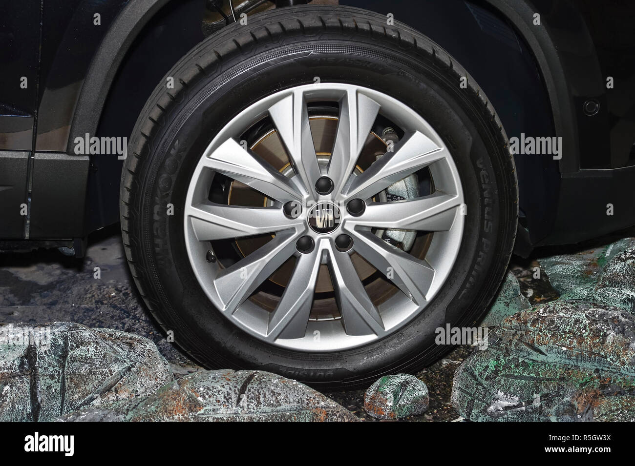 The front wheel of the car brands Seat close up in a shopping center ...