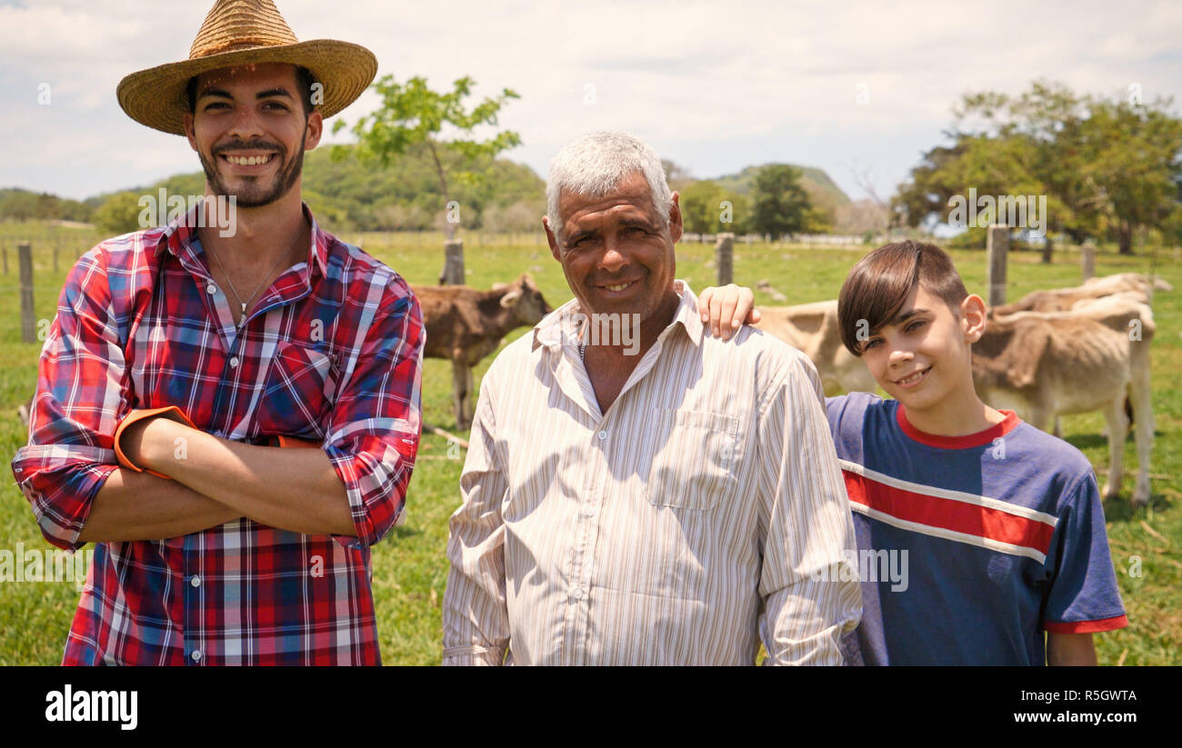 Three Generations Family Portrait Of Farmers In Farm Stock Photo - Alamy