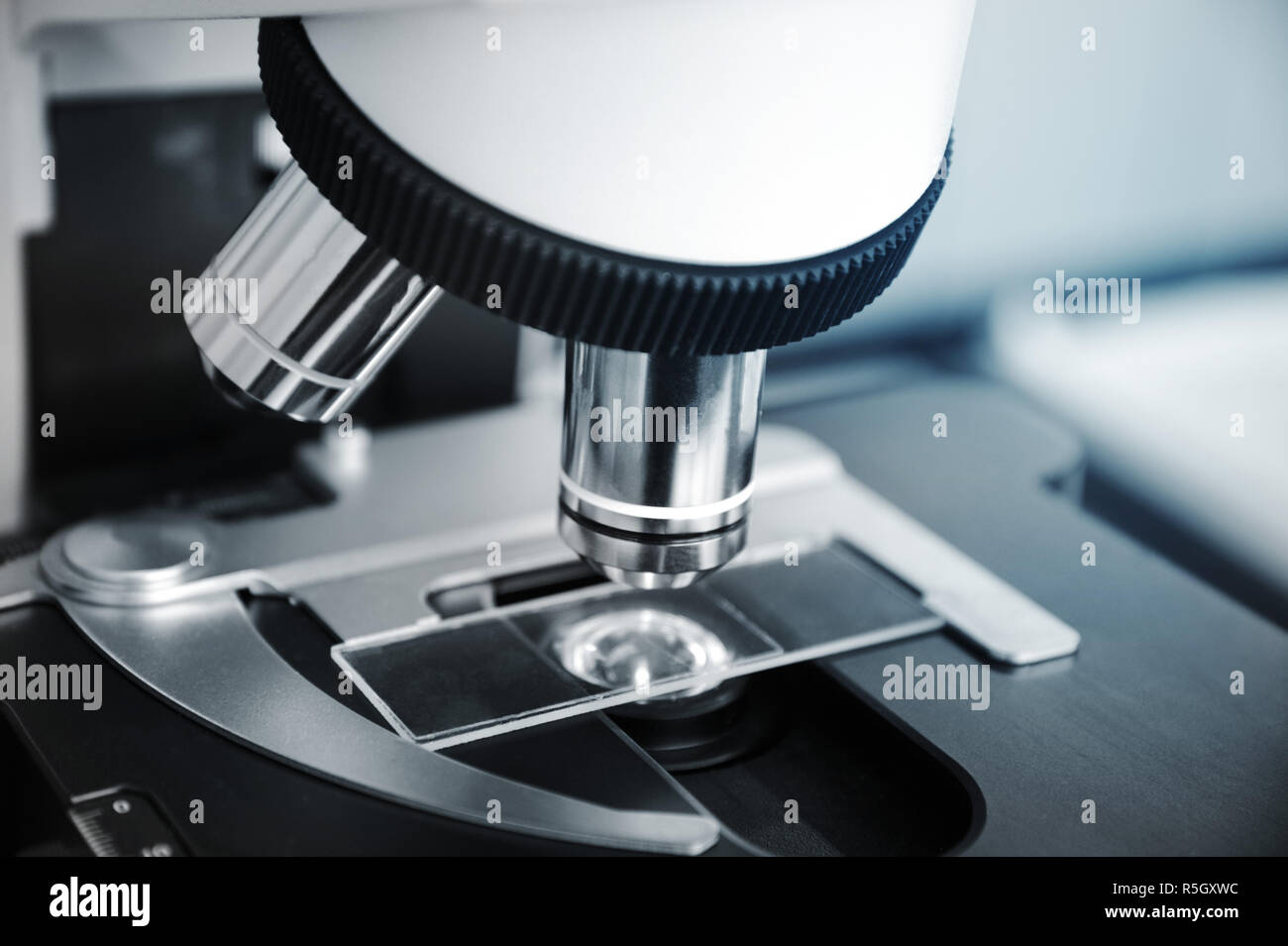 microscope with slide sample in reseach biology science laboratory ...