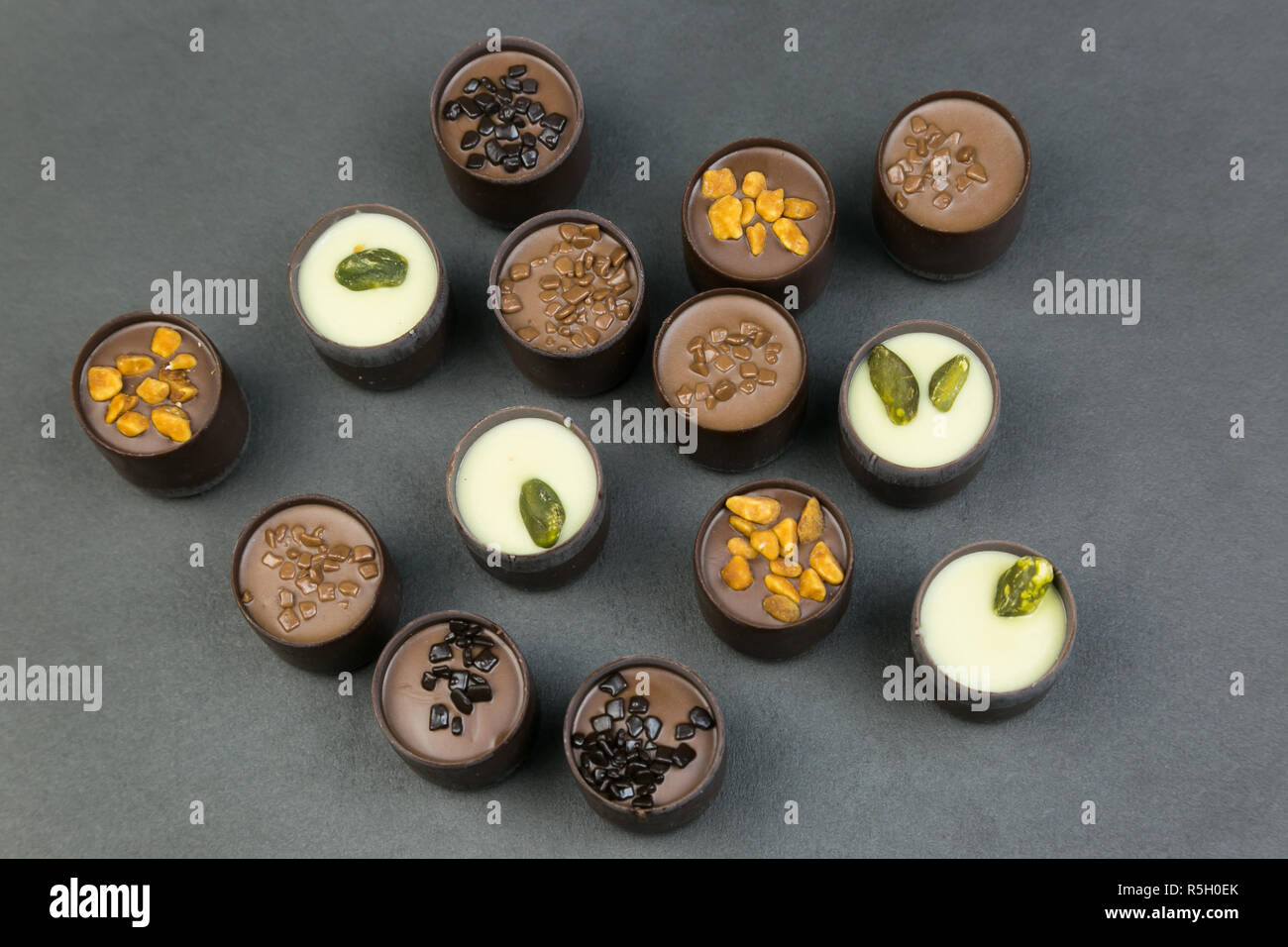 Candies with different fillings laid out on a color table Stock Photo ...