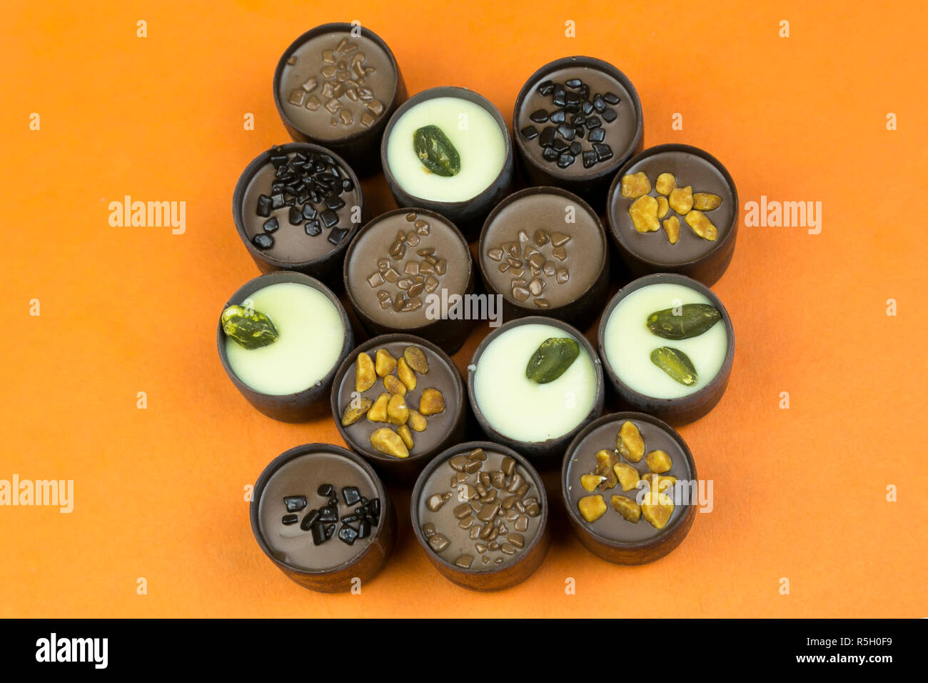 Candies with different fillings laid out on a color table Stock Photo ...