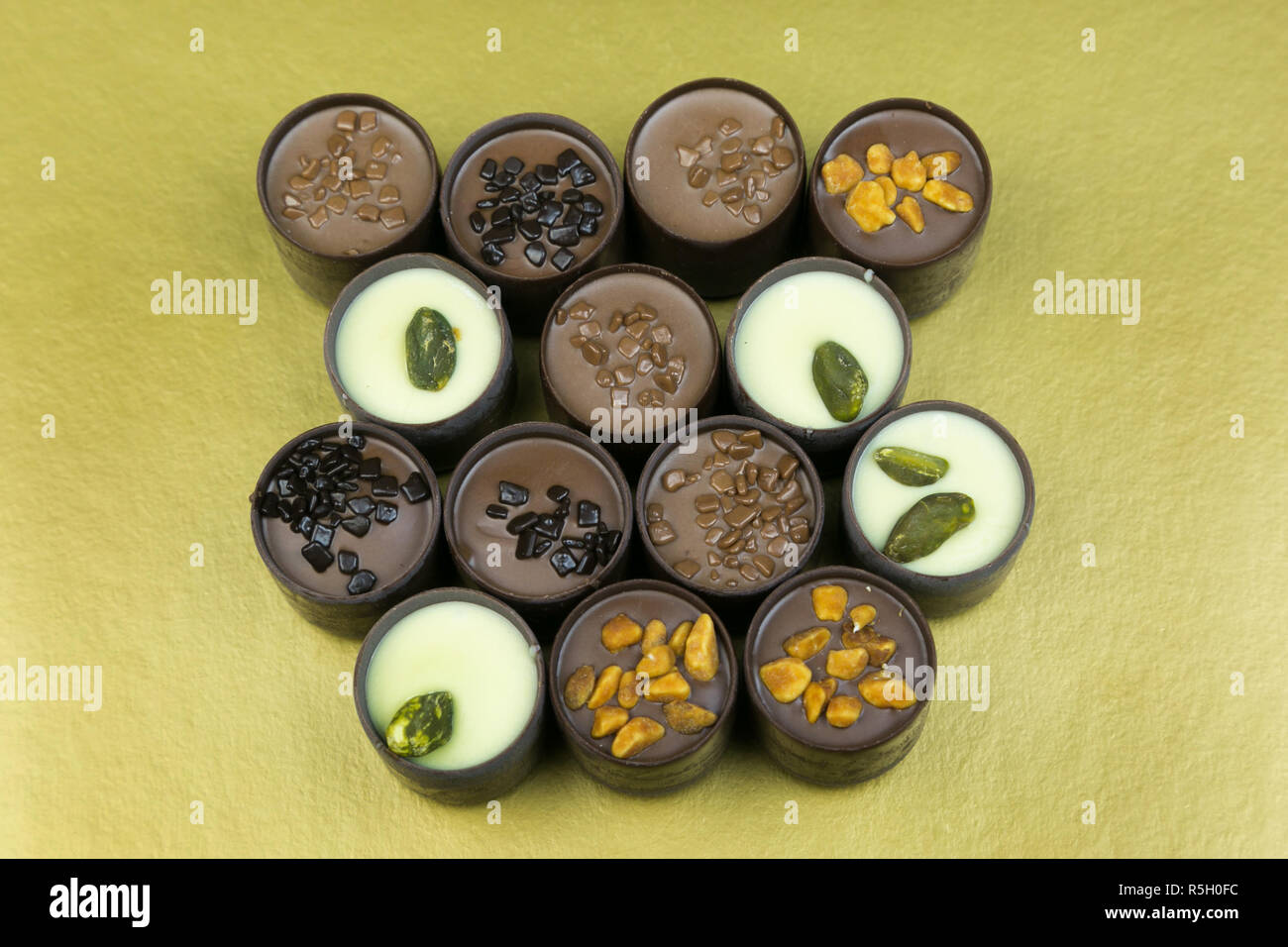 Candies with different fillings laid out on a color table Stock Photo ...