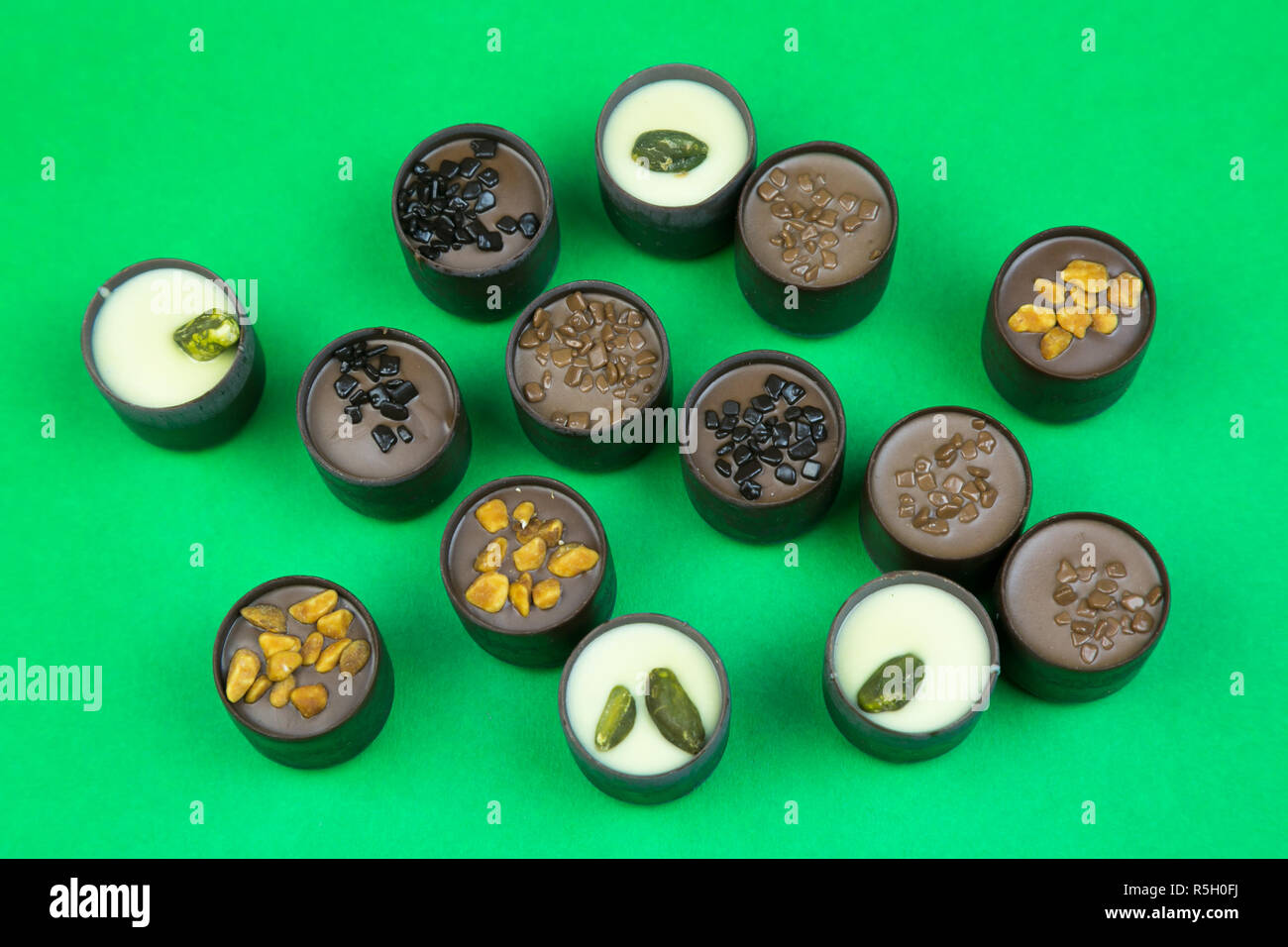 Candies with different fillings laid out on a color table Stock Photo ...