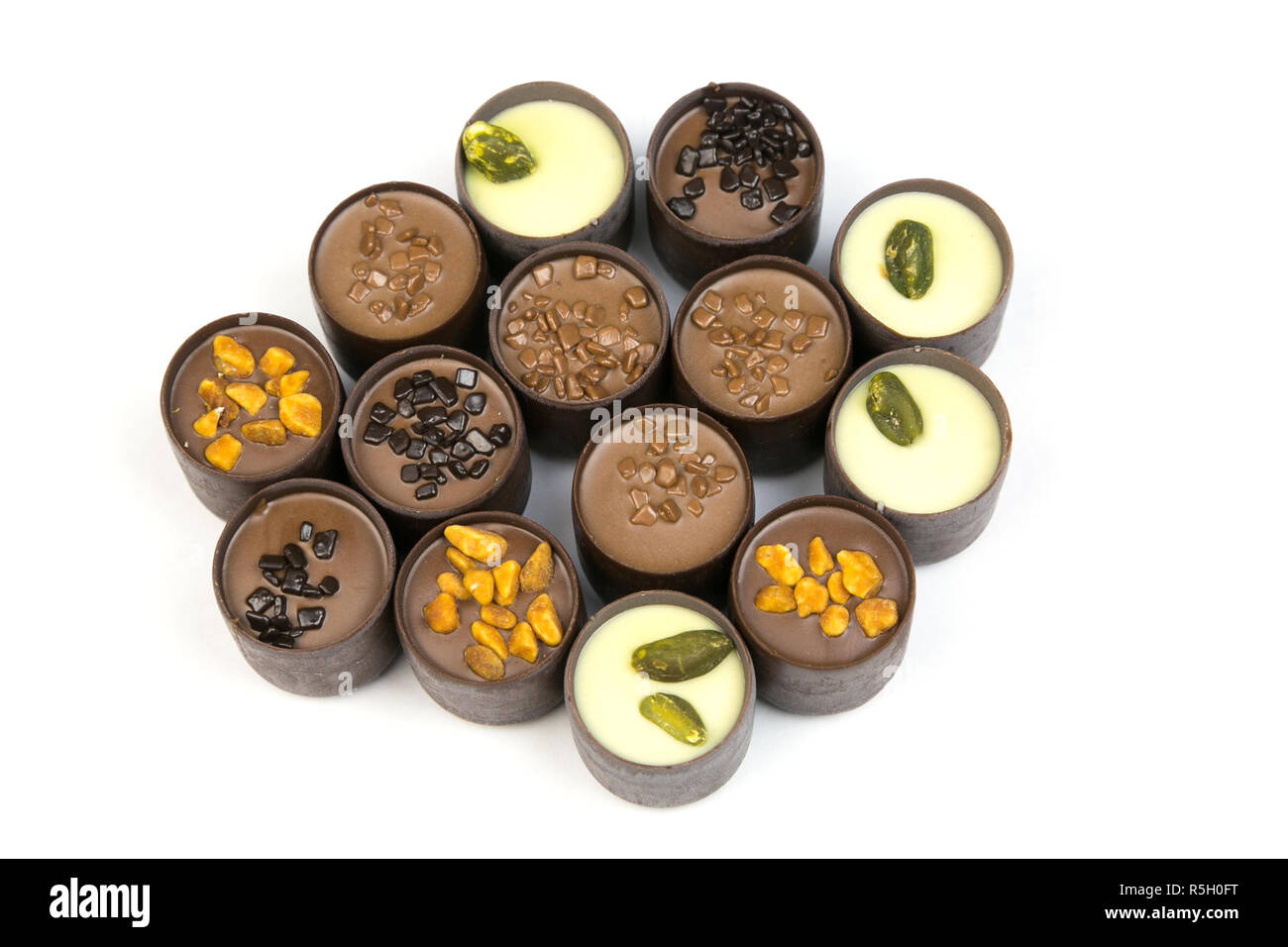 Beautiful sweet candies with different fillings on a white background ...