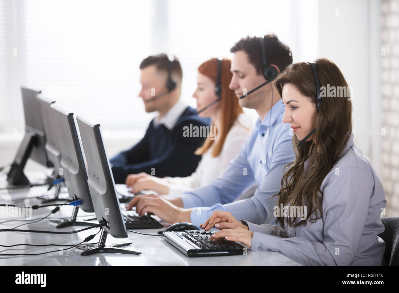 Call Center Team In Office Stock Photo - Alamy