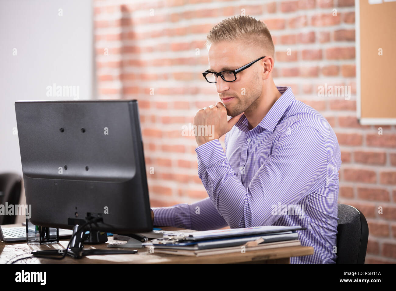 Serious Businessman Using Computer Stock Photo - Alamy