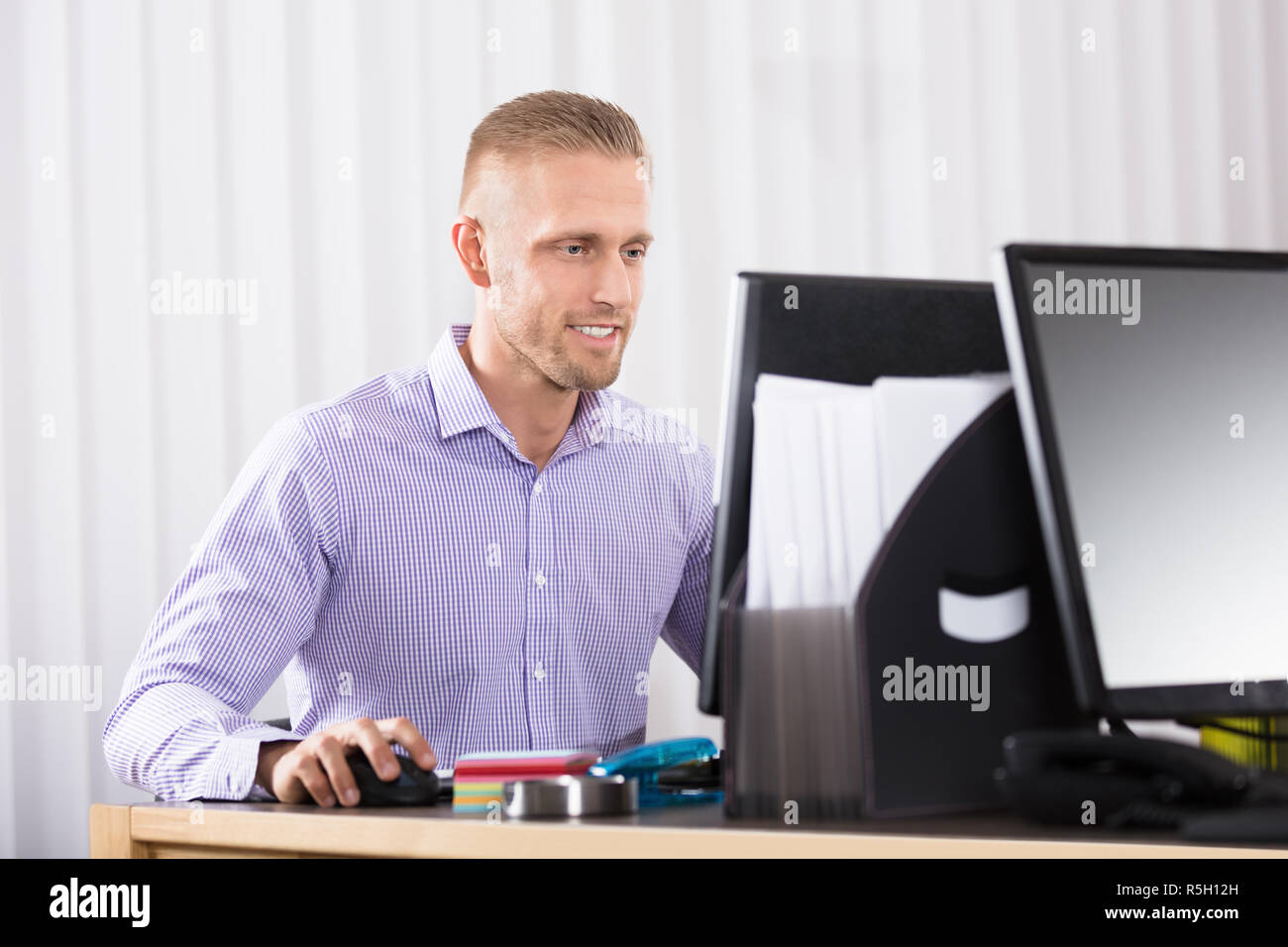 Delighted handsome businessman sitting hi-res stock photography and ...