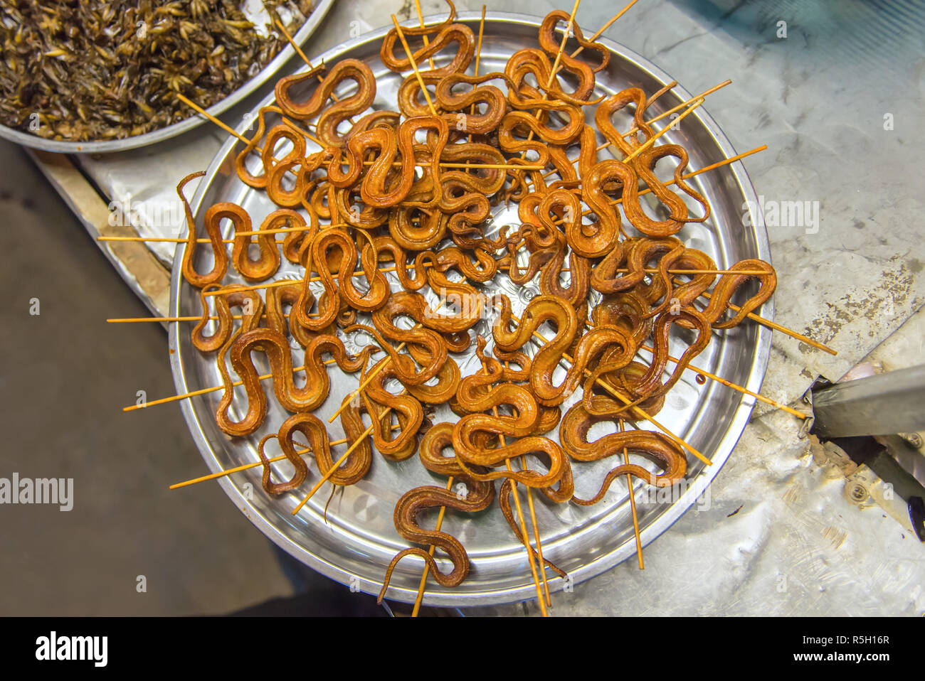 grilled snakes on sale for food market in China Stock Photo - Alamy