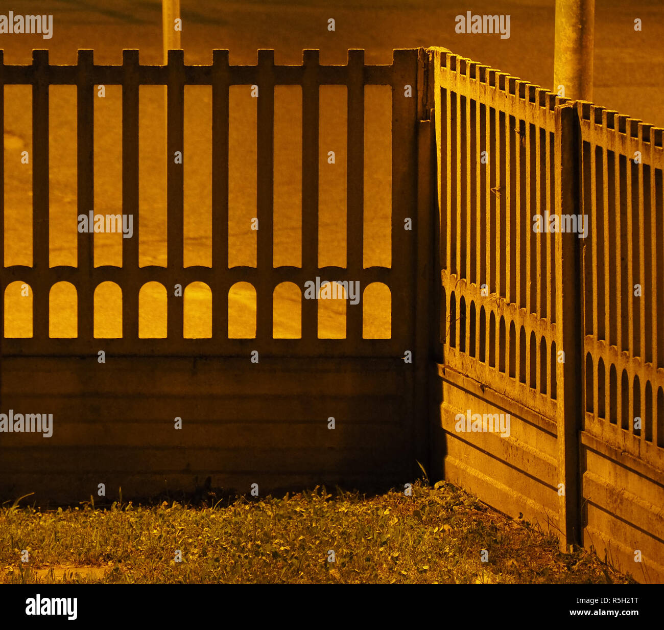 concrete fence at night Stock Photo - Alamy