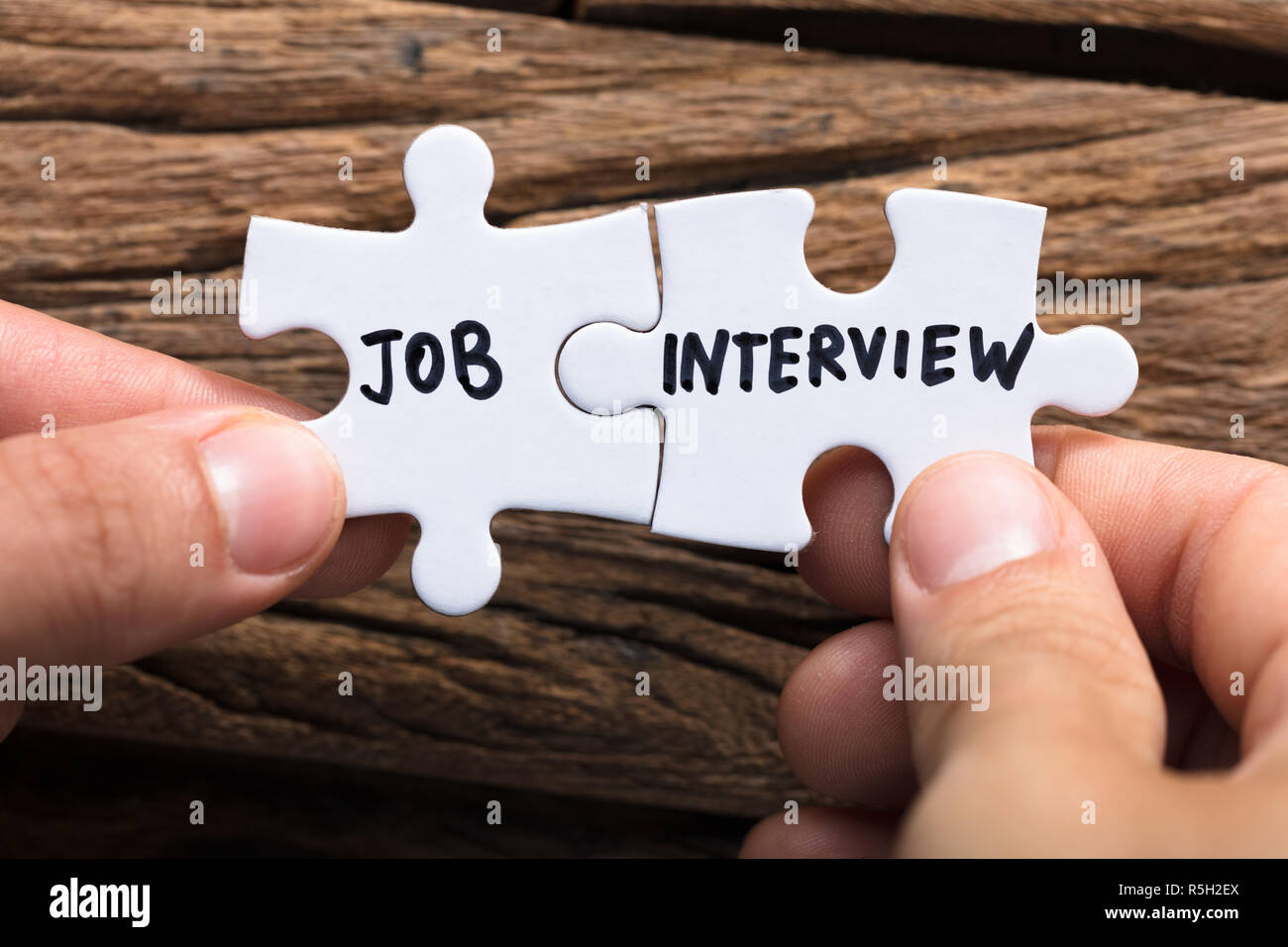 Hands Connecting Job Interview Jigsaw Pieces Stock Photo - Alamy