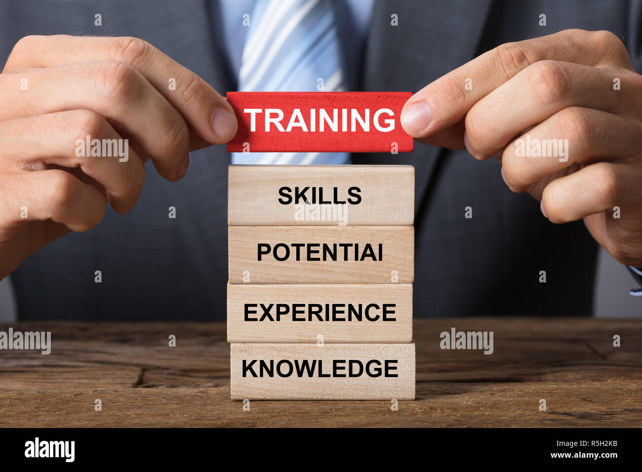 Businessman Building Training Concept With Wooden Blocks Stock Photo ...