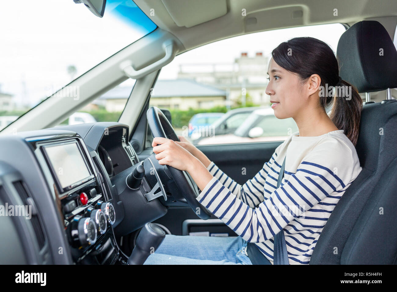 Asian Woman driving car Stock Photo - Alamy