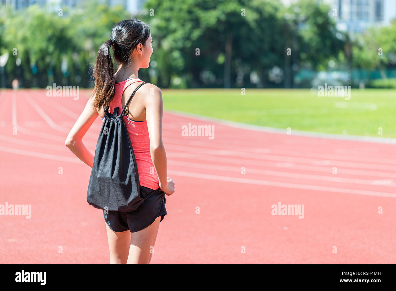 Sport woman in sport complex Stock Photo - Alamy