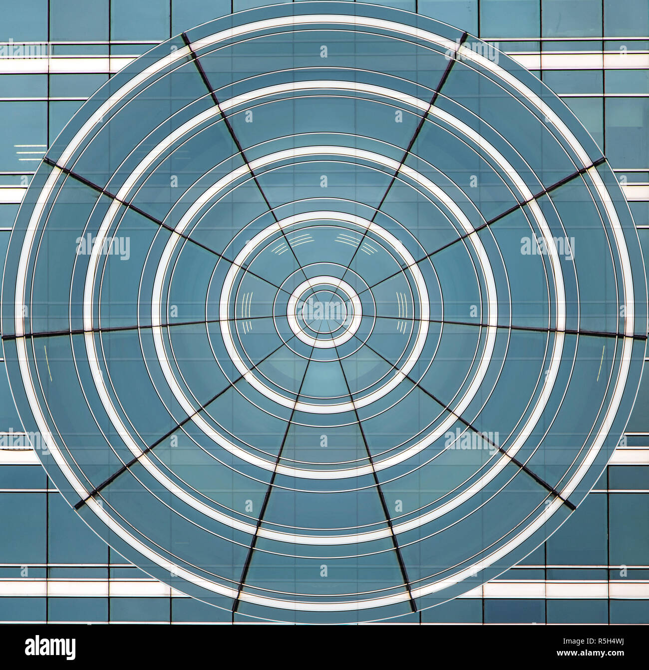 The blue circle of deformed windows on background of house facade Stock ...