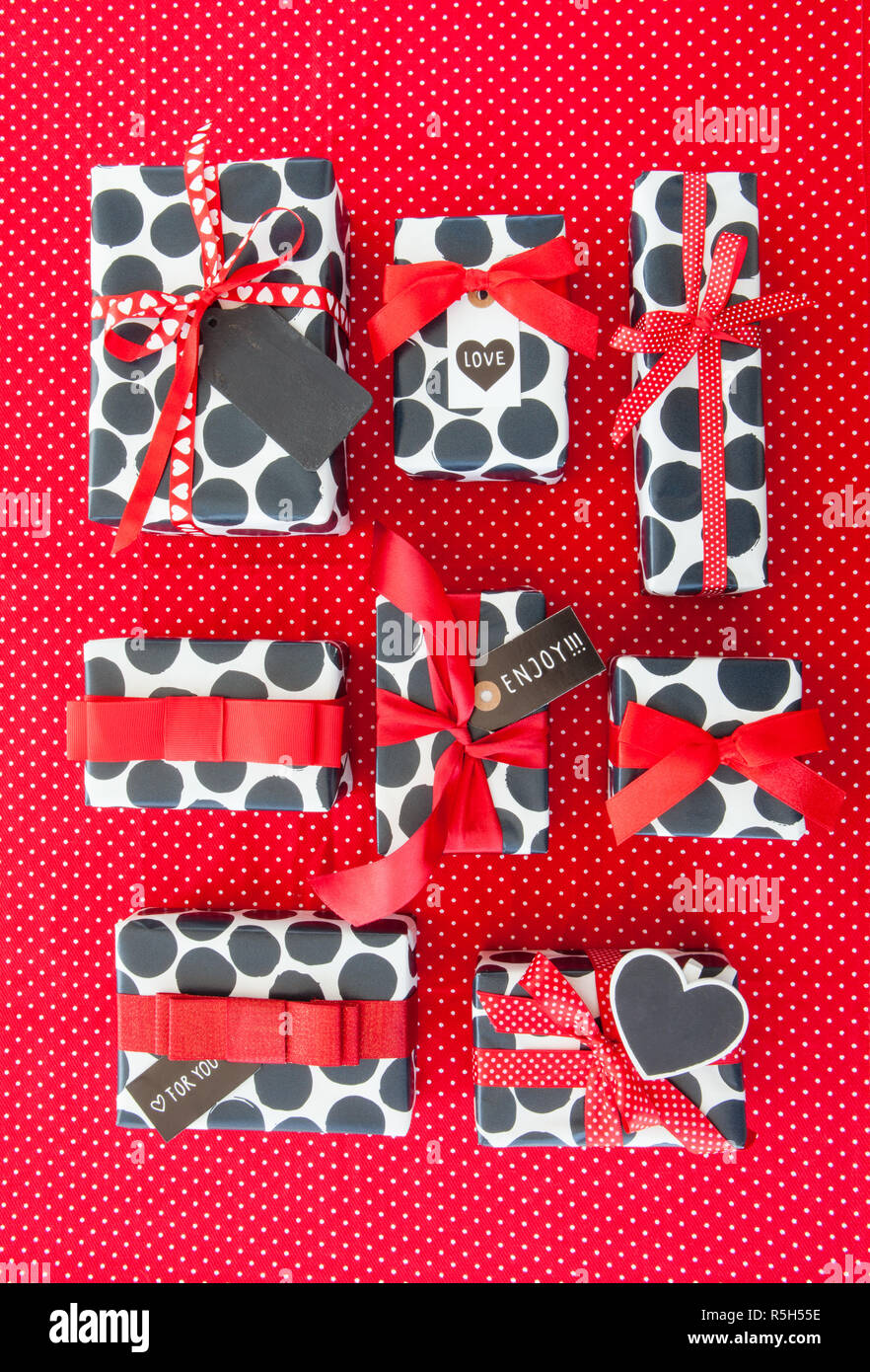 little presents with red ribbons Stock Photo - Alamy