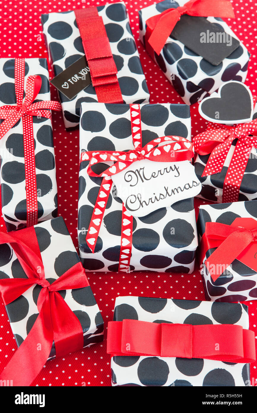 little presents with red ribbons Stock Photo - Alamy