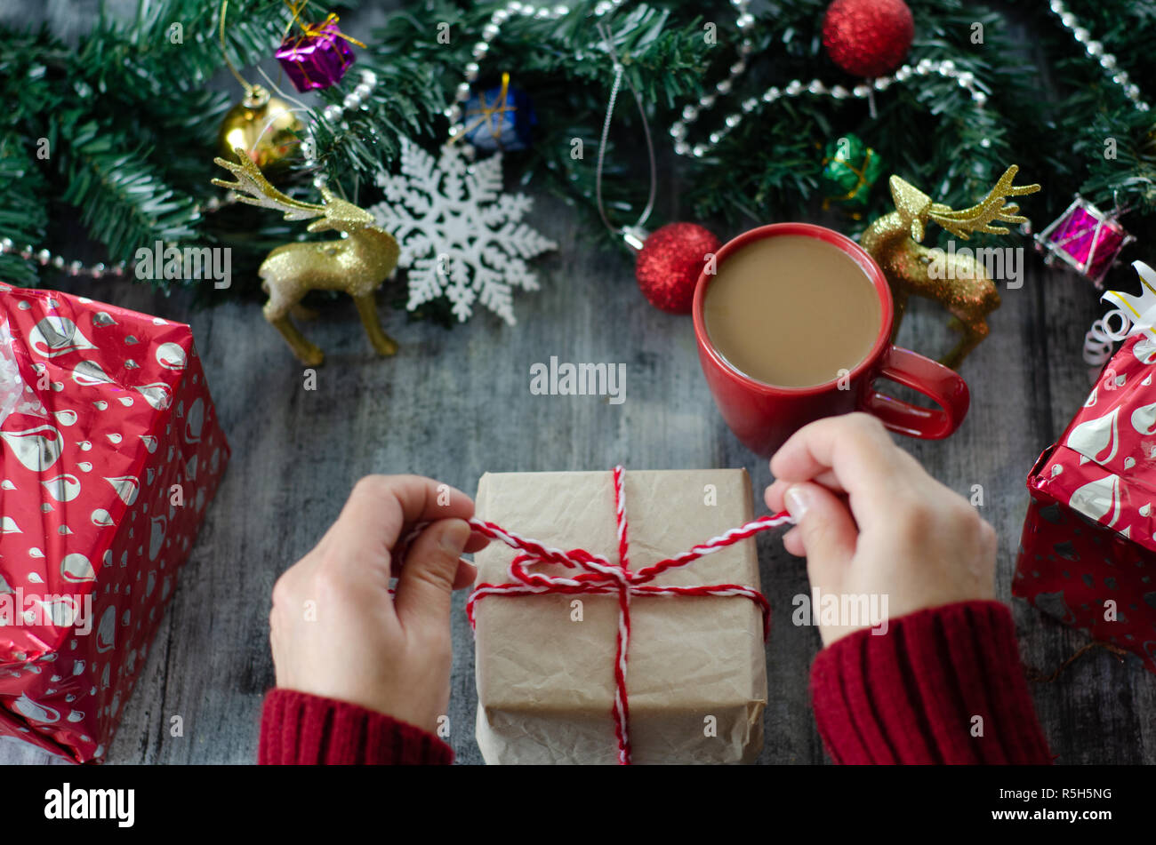 Christmas background with decorations and gift boxes on wooden board ...