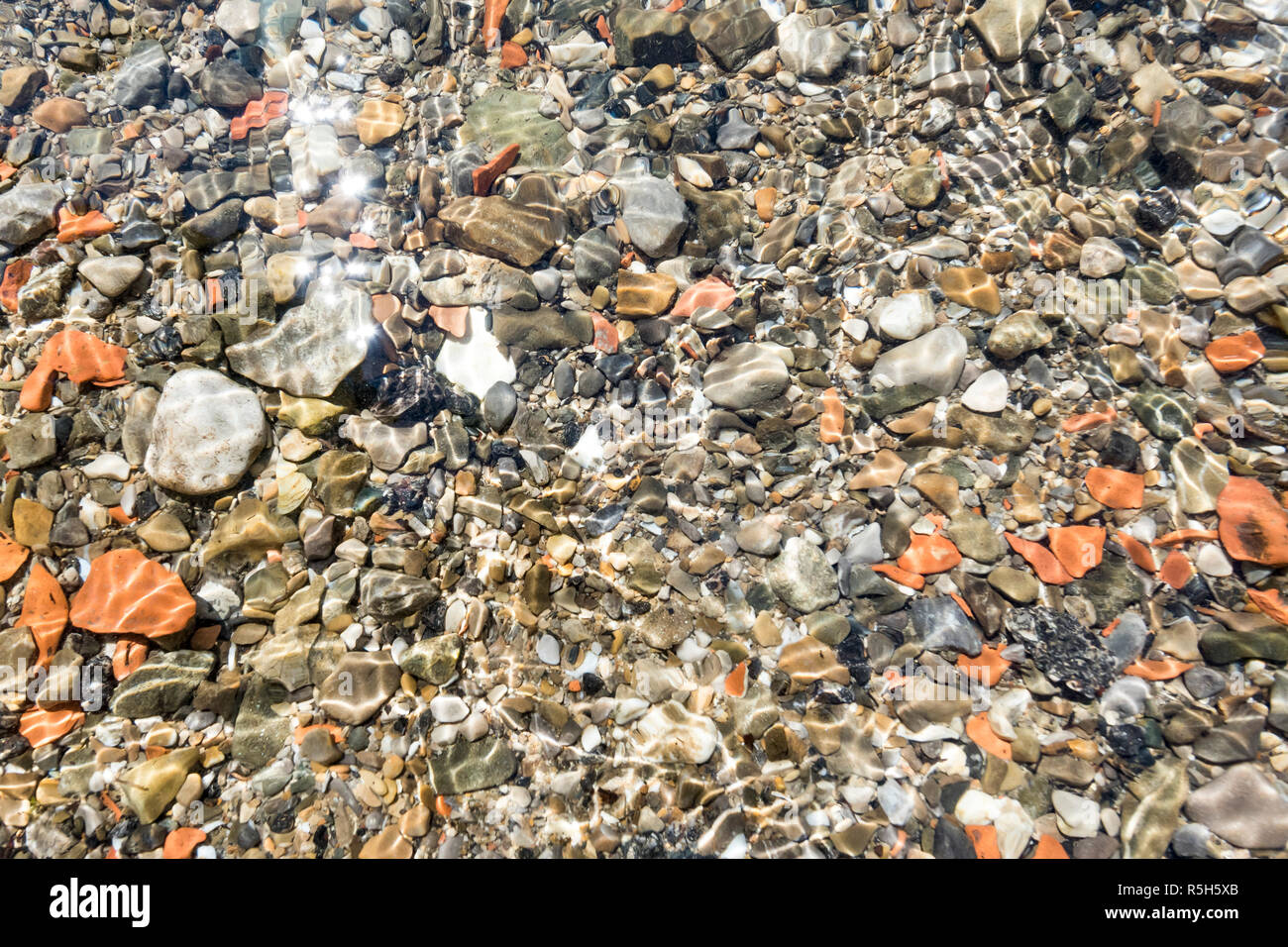 underwater pebbles lying in the sunshine Stock Photo - Alamy