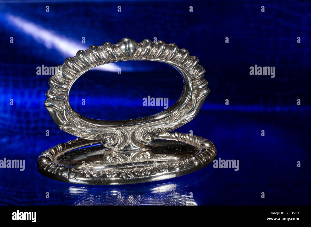 Ornate Antique Silver Paperweight Resting on a Blue Surface Stock Photo ...