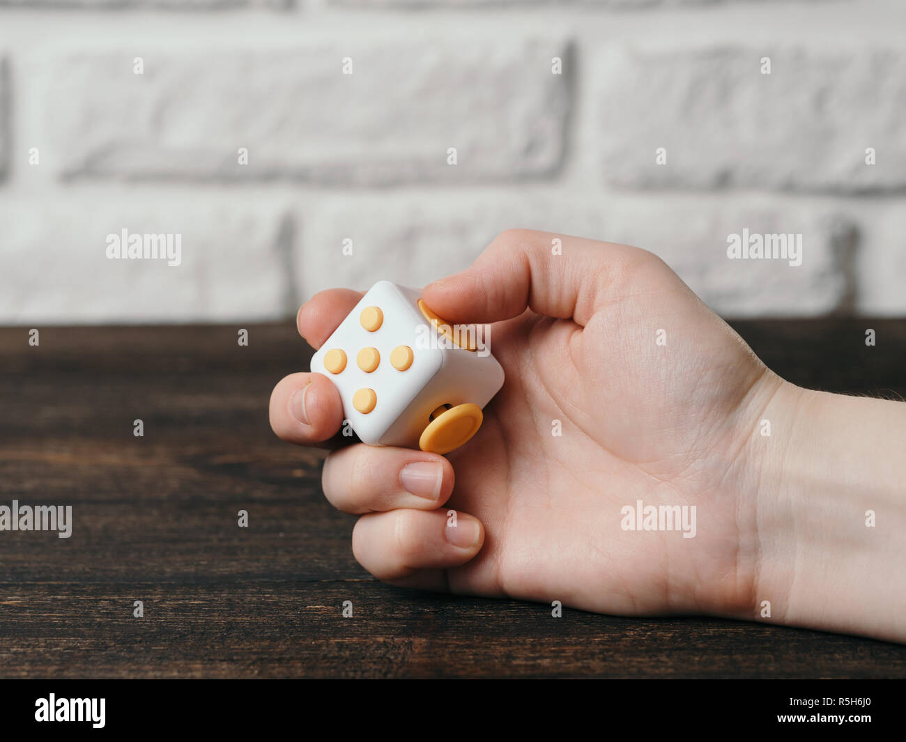 Fidget cube stress fingers toy Stock Photo - Alamy