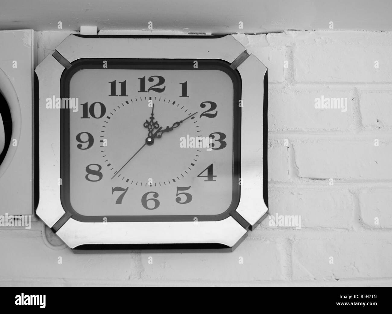 ANTIQUE CLOCK MOUNTED ON WALL Stock Photo - Alamy