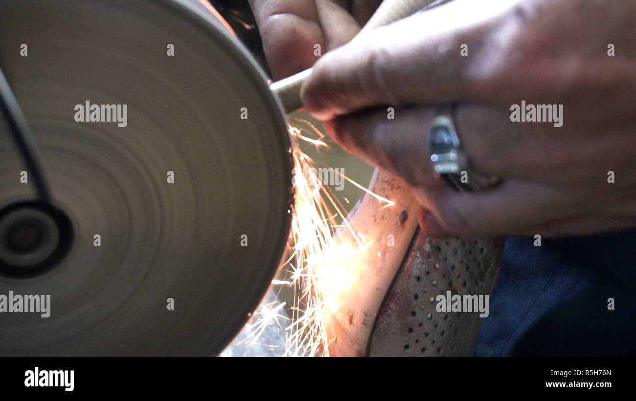 the shoemaker's sharpening metal taps on the machine Stock Photo - Alamy