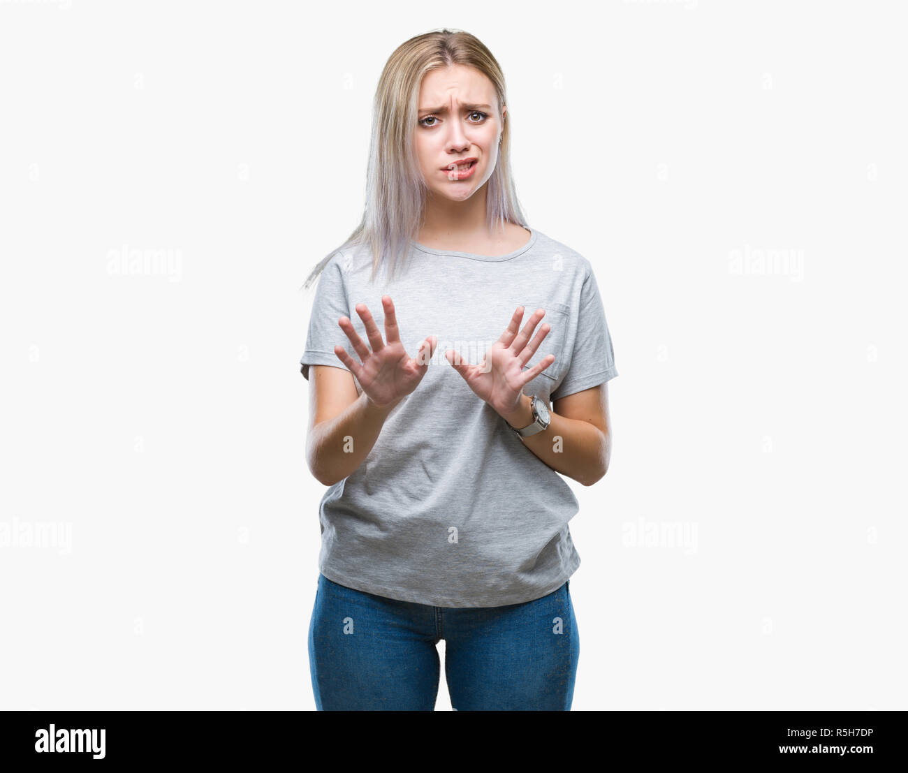 Young blonde woman over isolated background disgusted expression ...