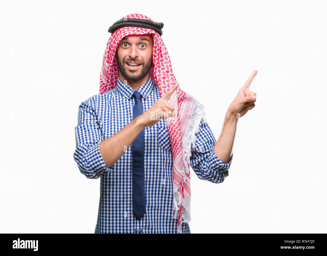 Young handsome arabian business man wearing keffiyeh over isolated ...