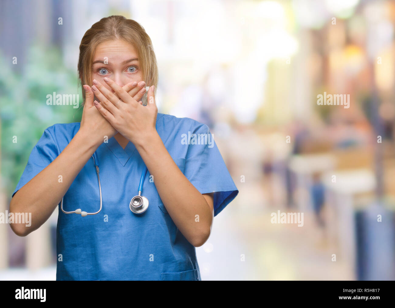 Young caucasian doctor woman wearing surgeon uniform over isolated ...