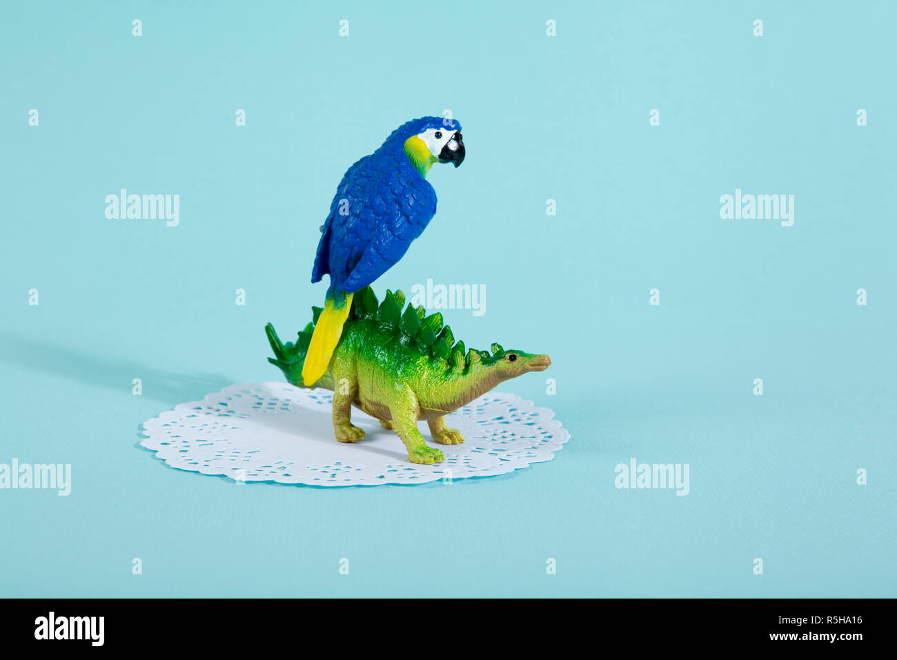 dinosaur and parrot Stock Photo - Alamy
