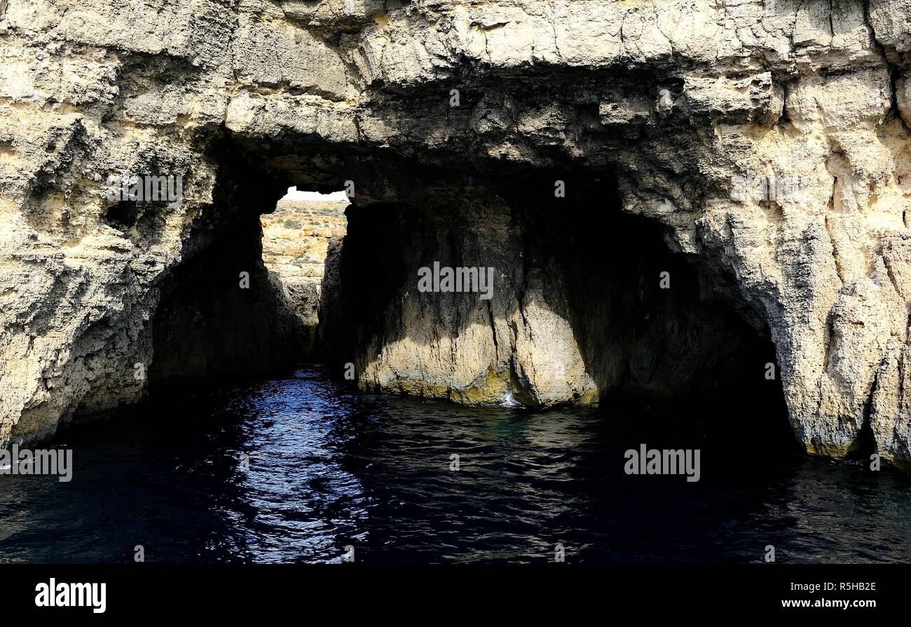The cliffs and caves of Comino Stock Photo - Alamy